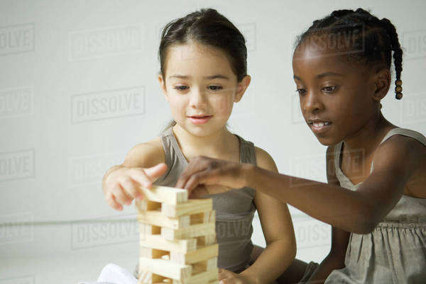 Two girls building tower with blocks together - Royalty-free Stock ...