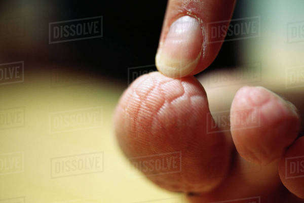 Finger touching toe with imprinted pattern, extreme close-up - Royalty ...