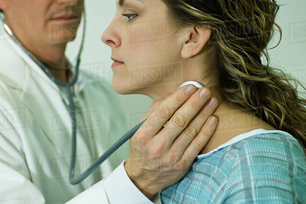 Doctor listening to patient's pulse with stethoscope - Royalty-free ...