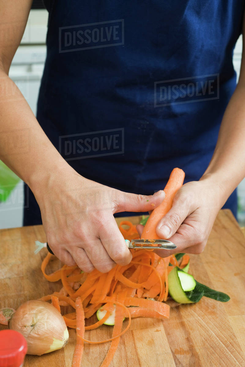 Peeling vegetables - Stock Photo - Dissolve