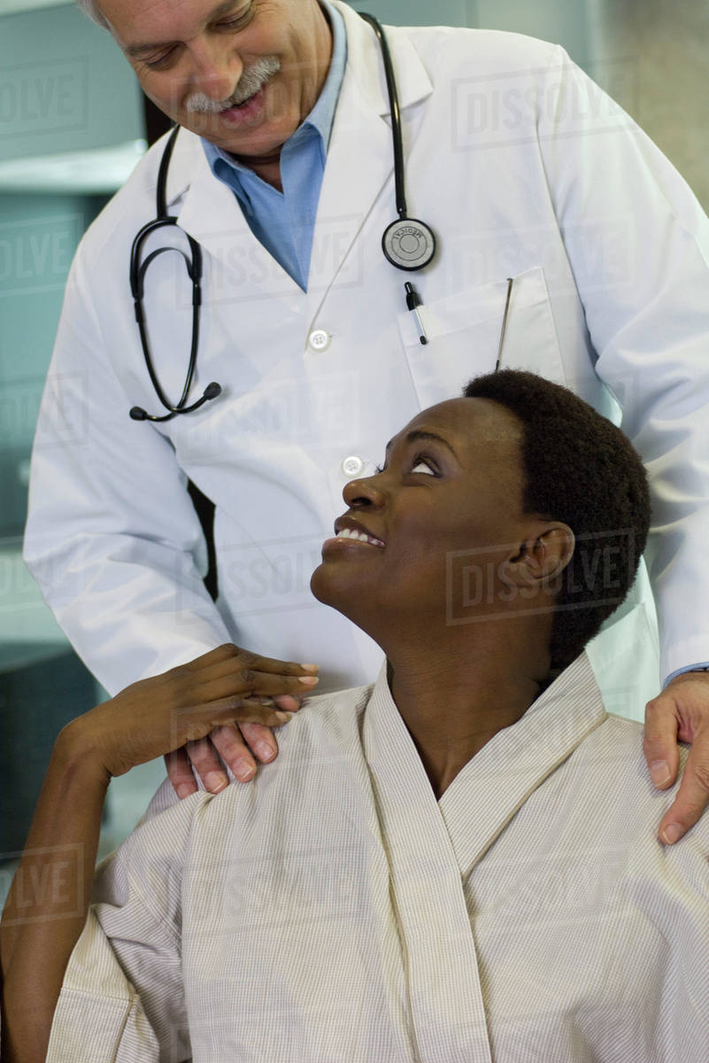 Doctor reassuring patient - Royalty-free Stock Photo | Dissolve