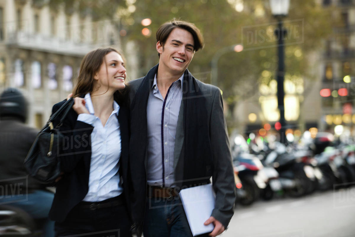 Couple crossing street together - Royalty-free Stock Photo | Dissolve