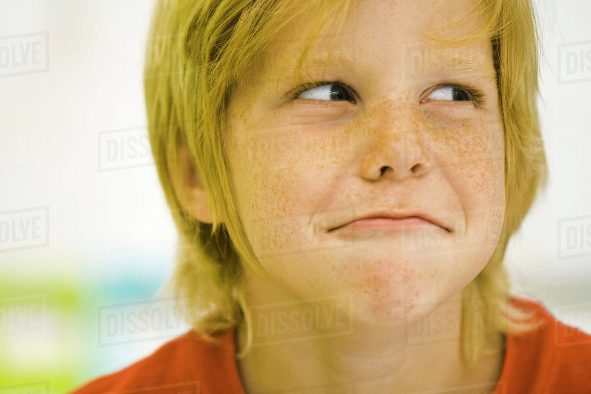 Little boy frowning - Royalty-free Stock Photo | Dissolve