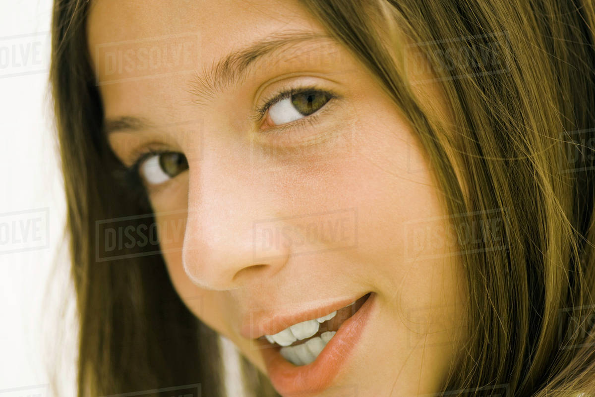 Girl glancing sideways at camera, portrait - Royalty-free Stock Photo ...