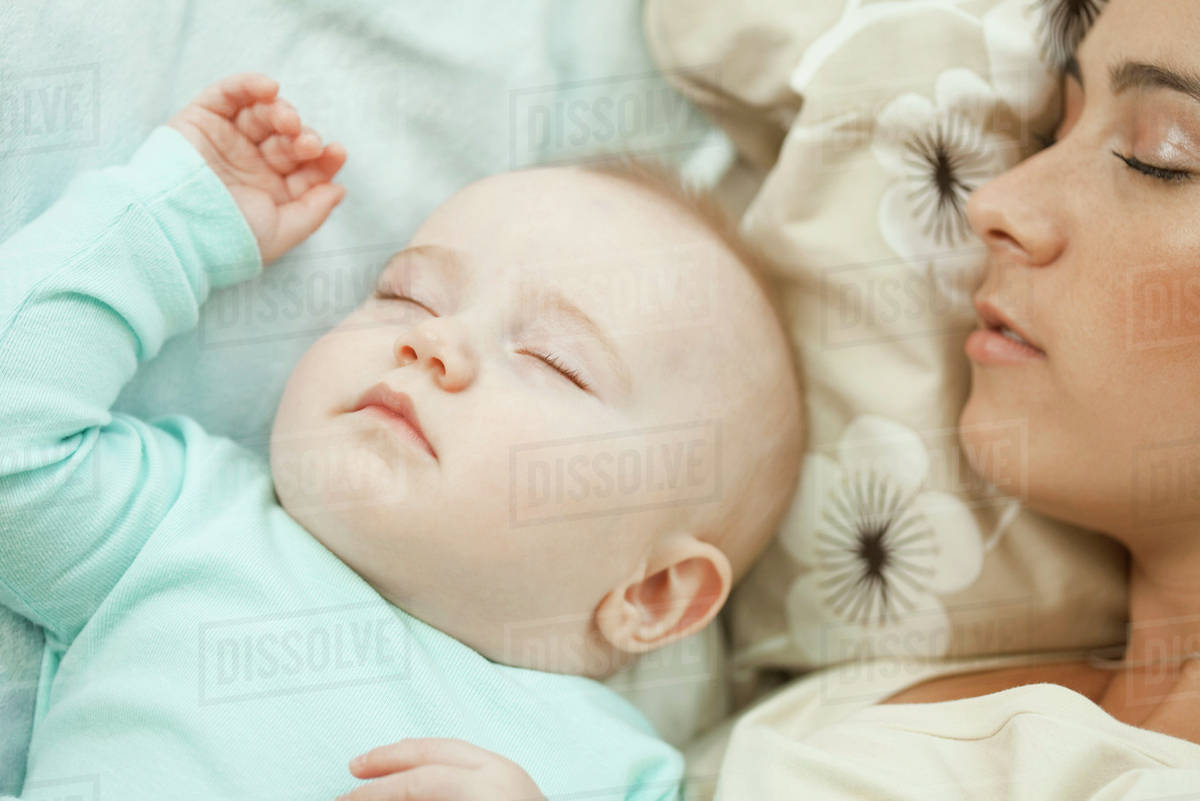 Baby napping with mother - Royalty-free Stock Photo | Dissolve
