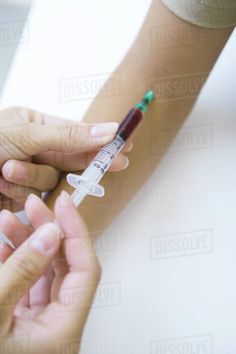 Doctor taking patient's blood with syringe, cropped view - Royalty-free ...