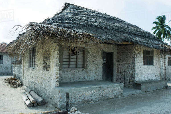 Tanzania, Zanzibar, house made of stone with thatched roof - Stock ...