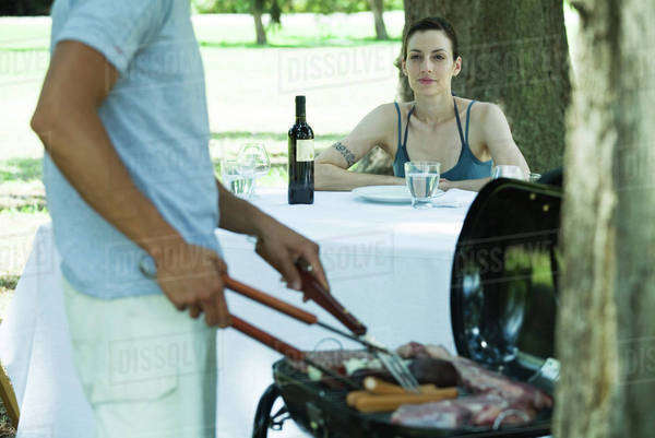 Couple having cookout - Stock Photo - Dissolve