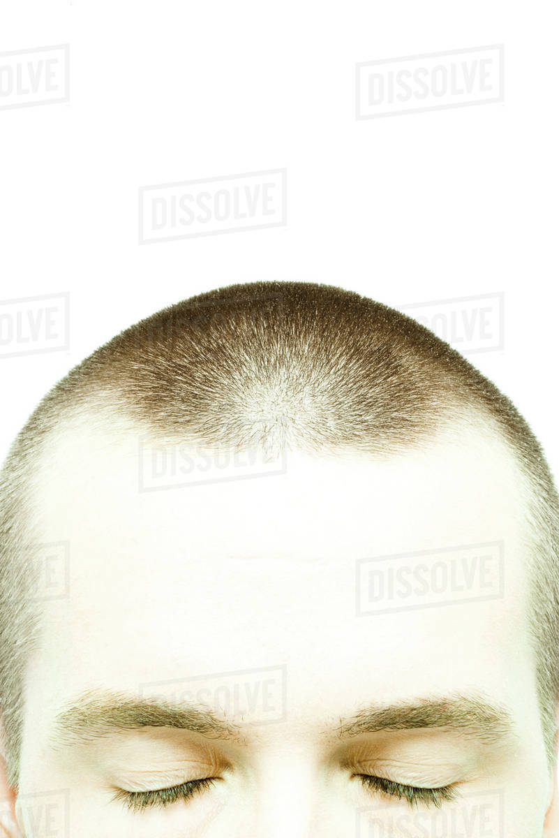 Young man with eyes closed, upper part of head, front view - Royalty ...