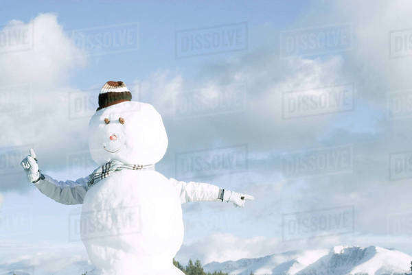 Snowman, person's arms emerging from behind, pointing in different ...