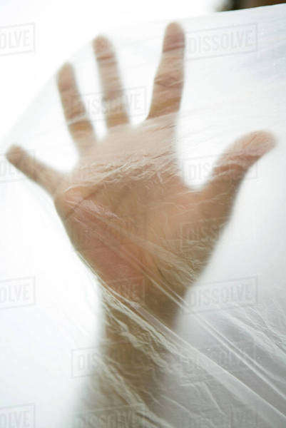 Hand inside plastic bag, cropped view - Royalty-free Stock Photo | Dissolve