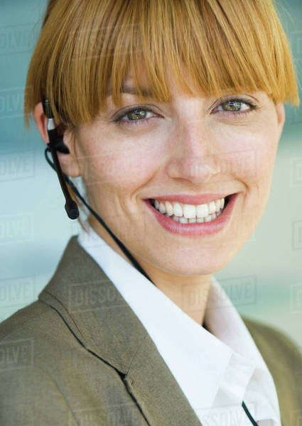 Woman wearing headset - Royalty-free Stock Photo | Dissolve