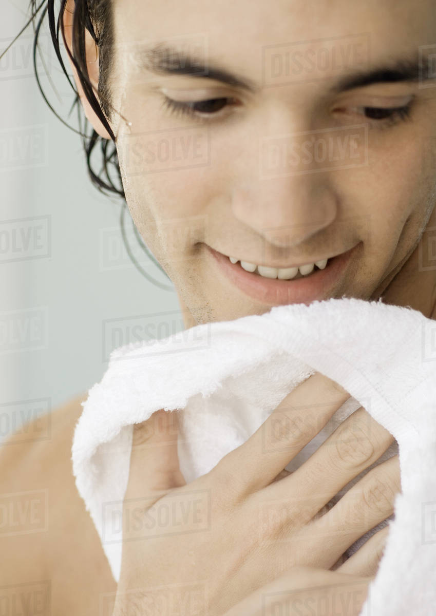 Man smiling and drying off with towel, close-up - Royalty-free Stock ...