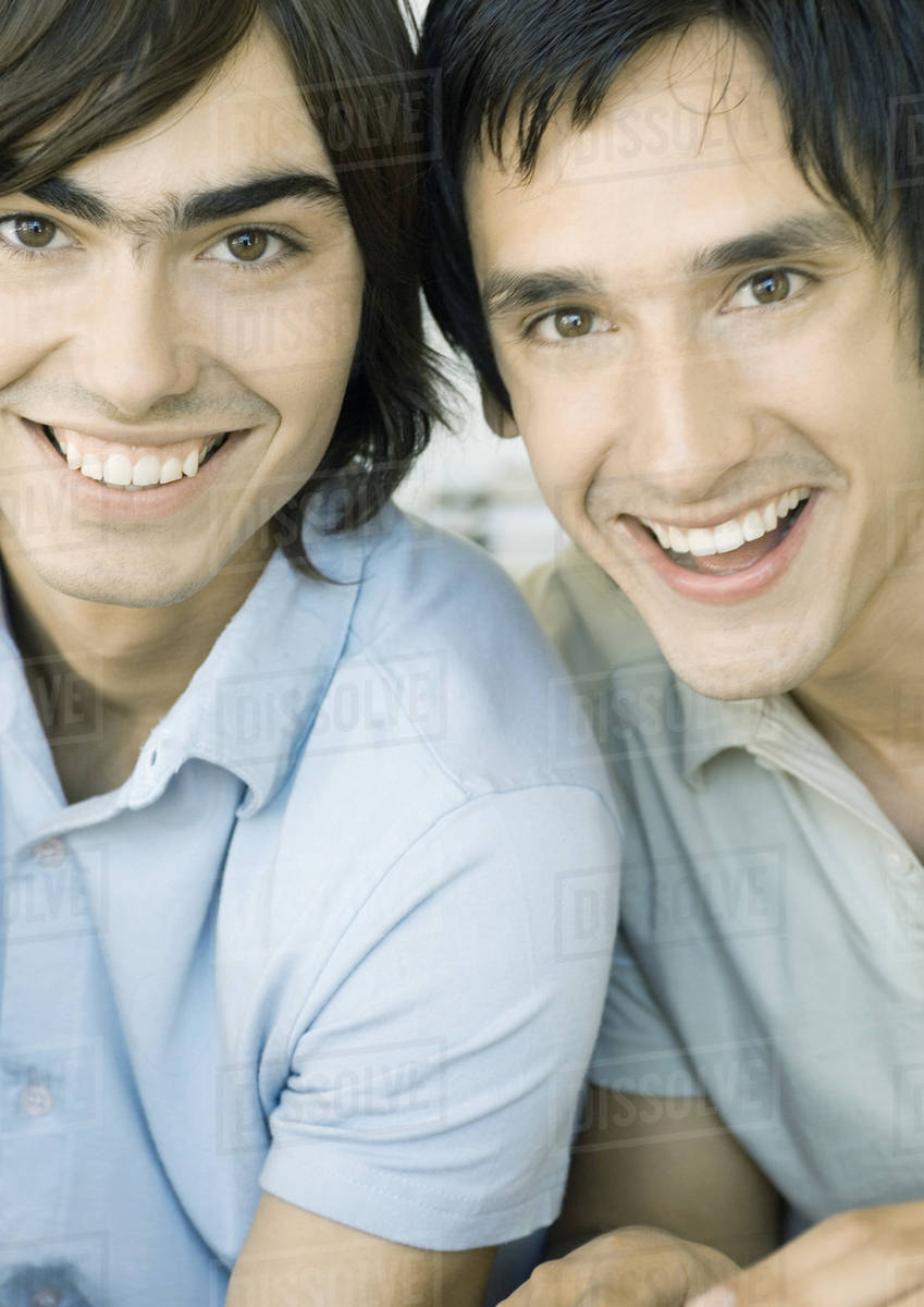 Two young men smiling - Royalty-free Stock Photo | Dissolve