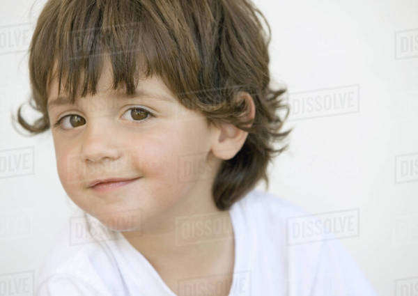 Mischievous boy looking at camera, portrait, close-up - Royalty-free ...