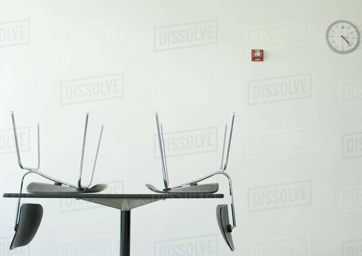 Chairs upside down on table in breakroom - Royalty-free Stock Photo ...
