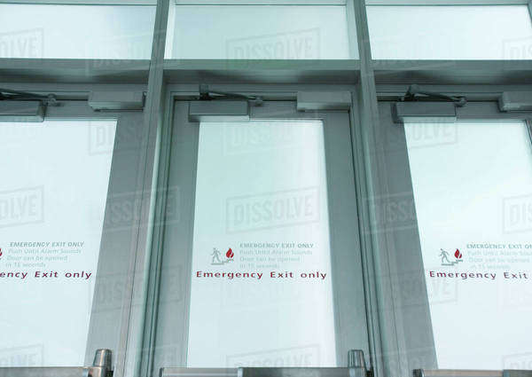 Emergency exit doors in airport, low angle view - Stock Photo - Dissolve