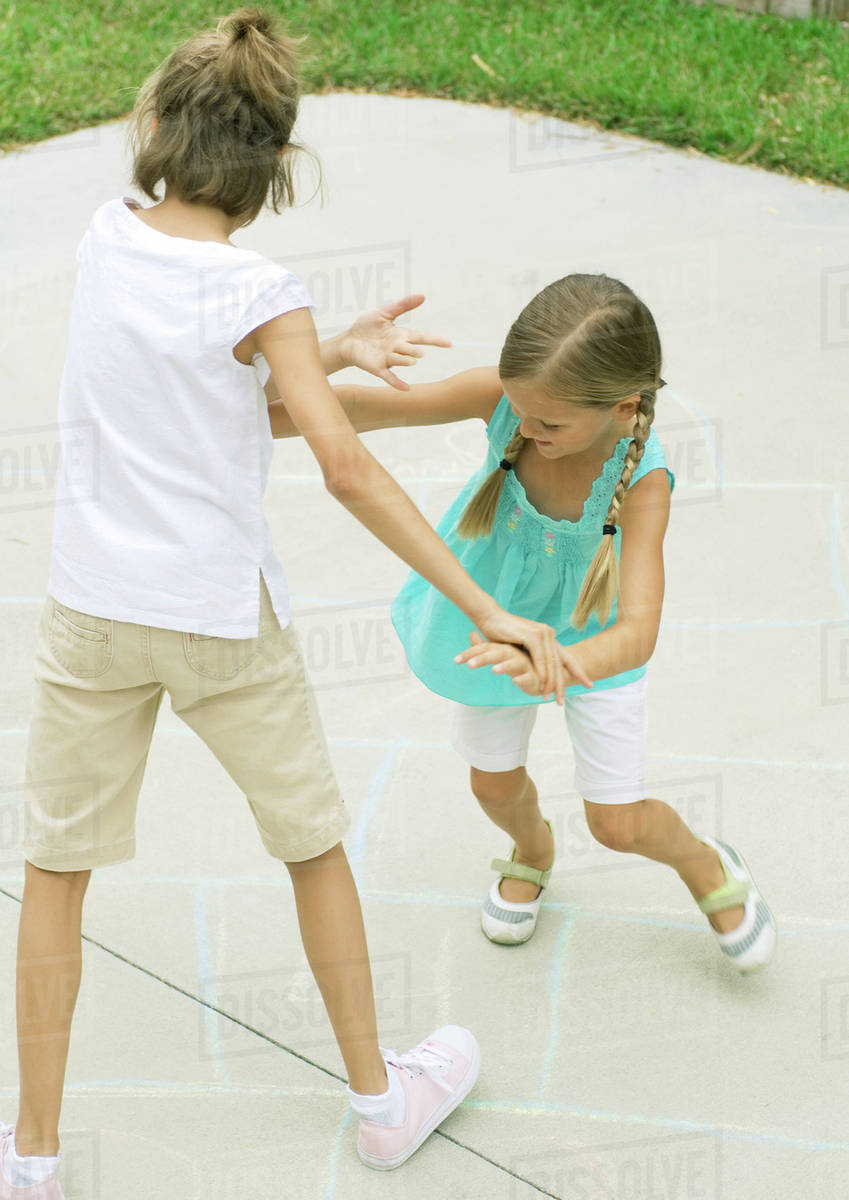 Girls playing hopscotch - Royalty-free Stock Photo | Dissolve