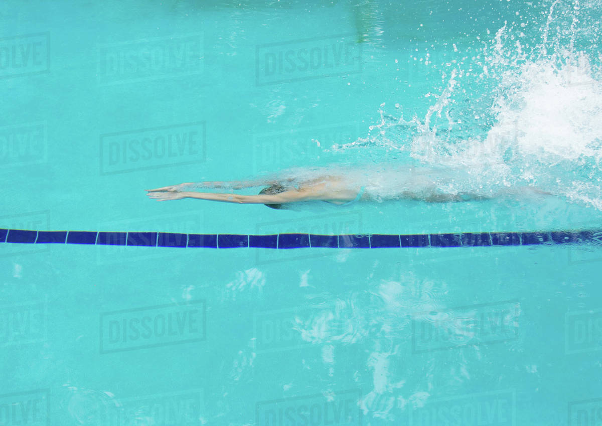 Woman under water after diving into pool - Royalty-free Stock Photo ...