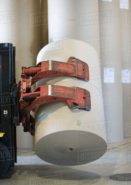 Forklift transporting roll of paper in warehouse - Royalty-free Stock ...