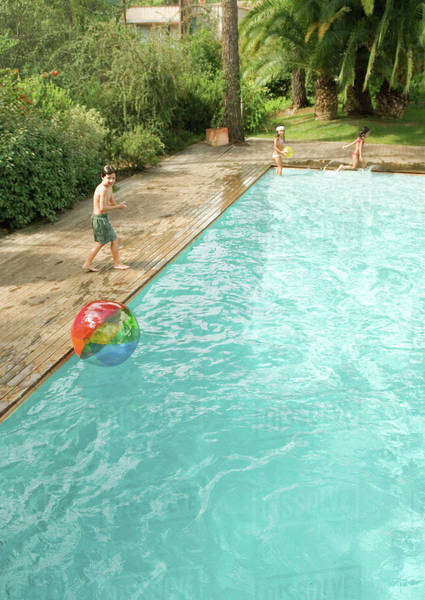 Children playing around swimming pool - Royalty-free Stock Photo | Dissolve