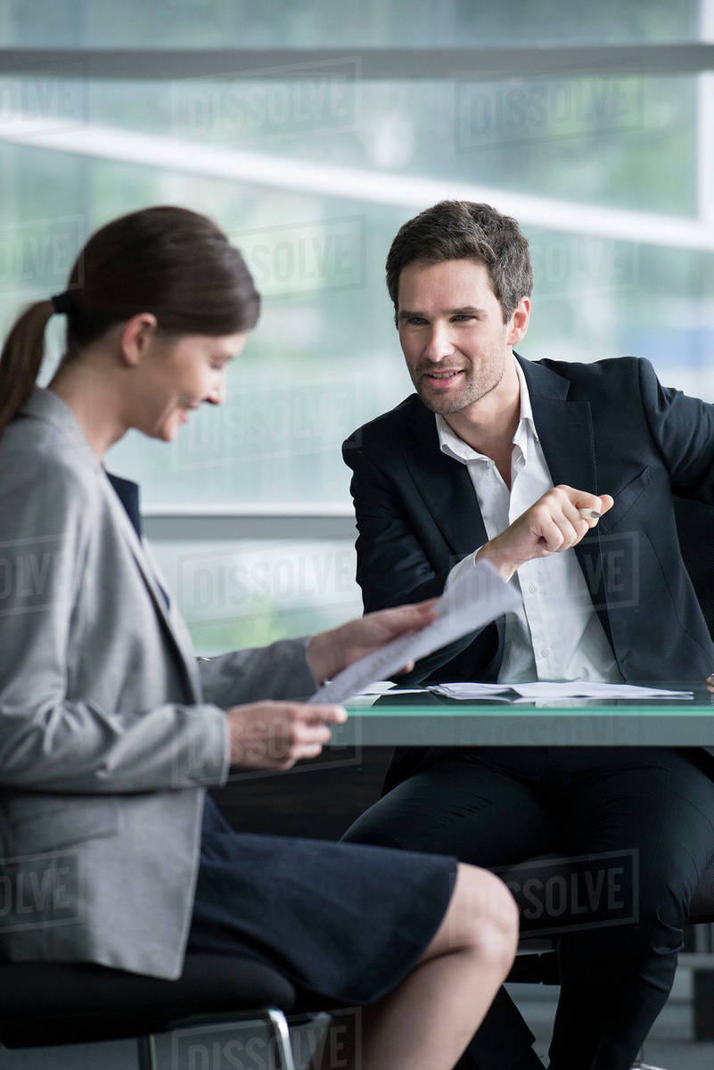 Businessman explaining document to client - Royalty-free Stock Photo ...