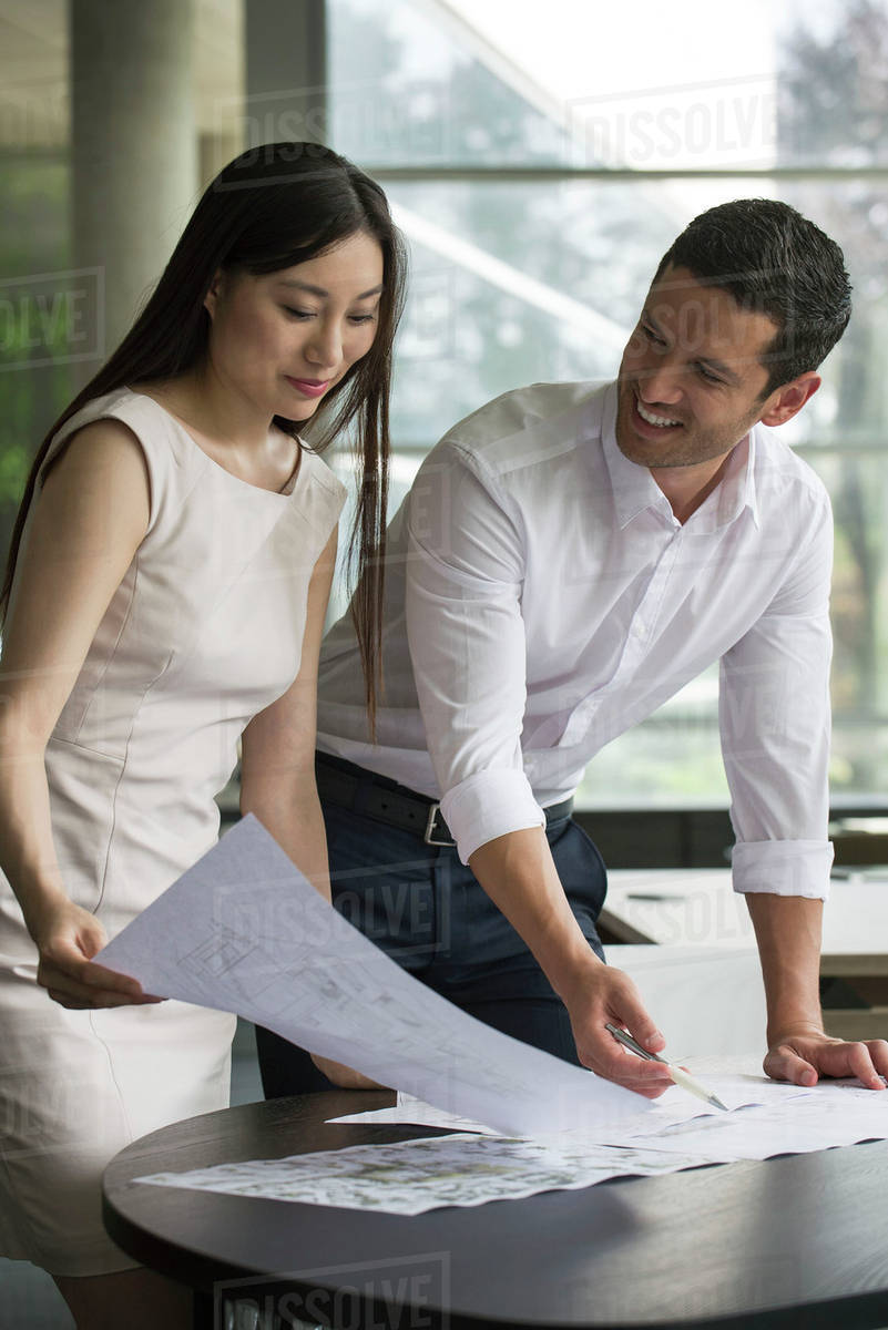 Engineers working on design together - Stock Photo - Dissolve