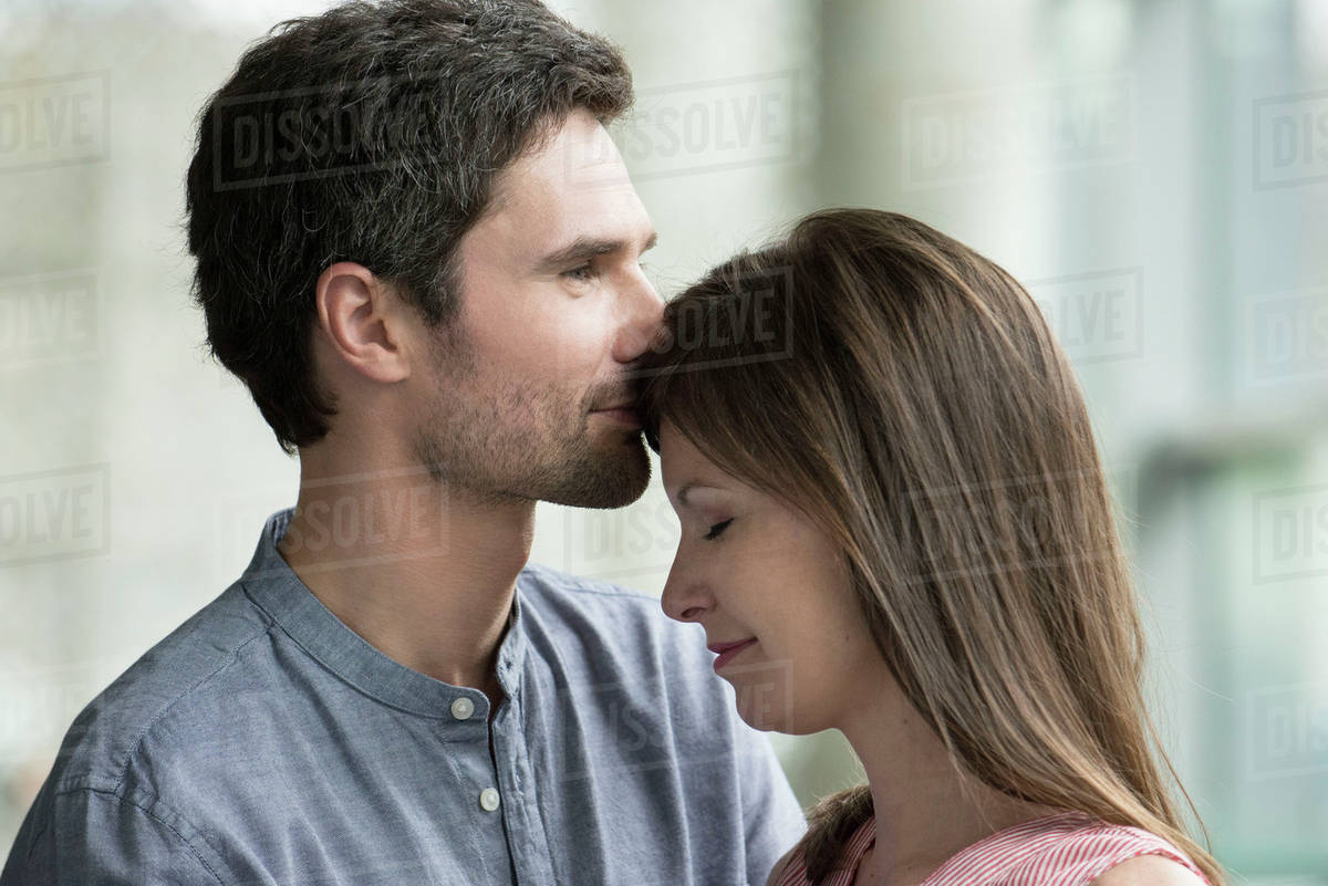 Couple nuzzling - Royalty-free Stock Photo | Dissolve