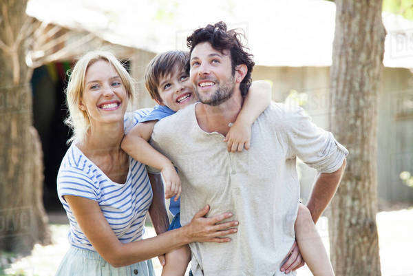 Family with one child, portrait - Stock Photo - Dissolve