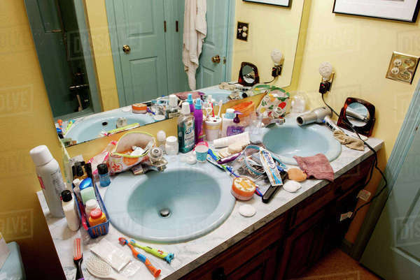 Bathroom sinks cluttered with health and beauty products - Royalty-free ...