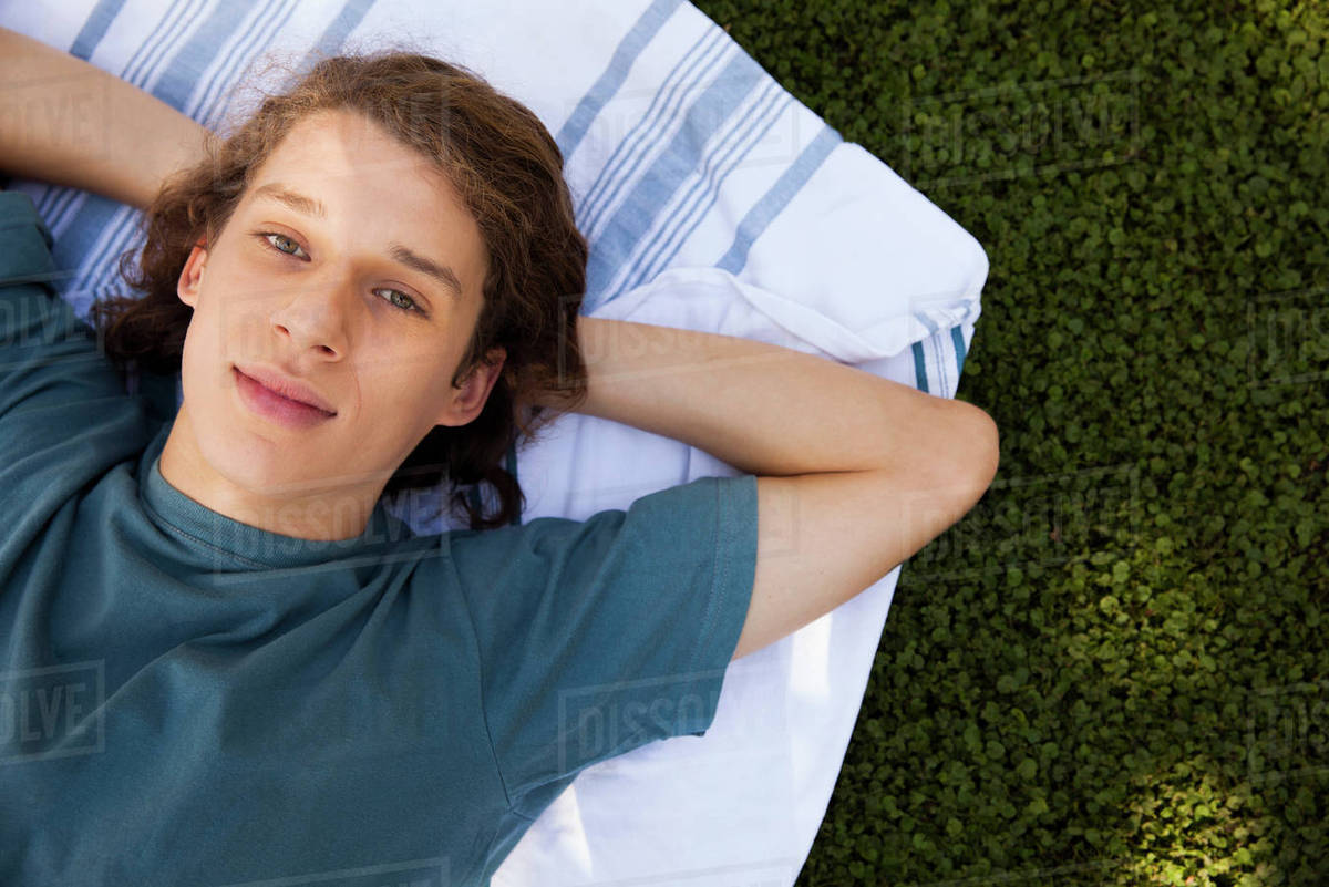 Young man daydreaming - Royalty-free Stock Photo | Dissolve