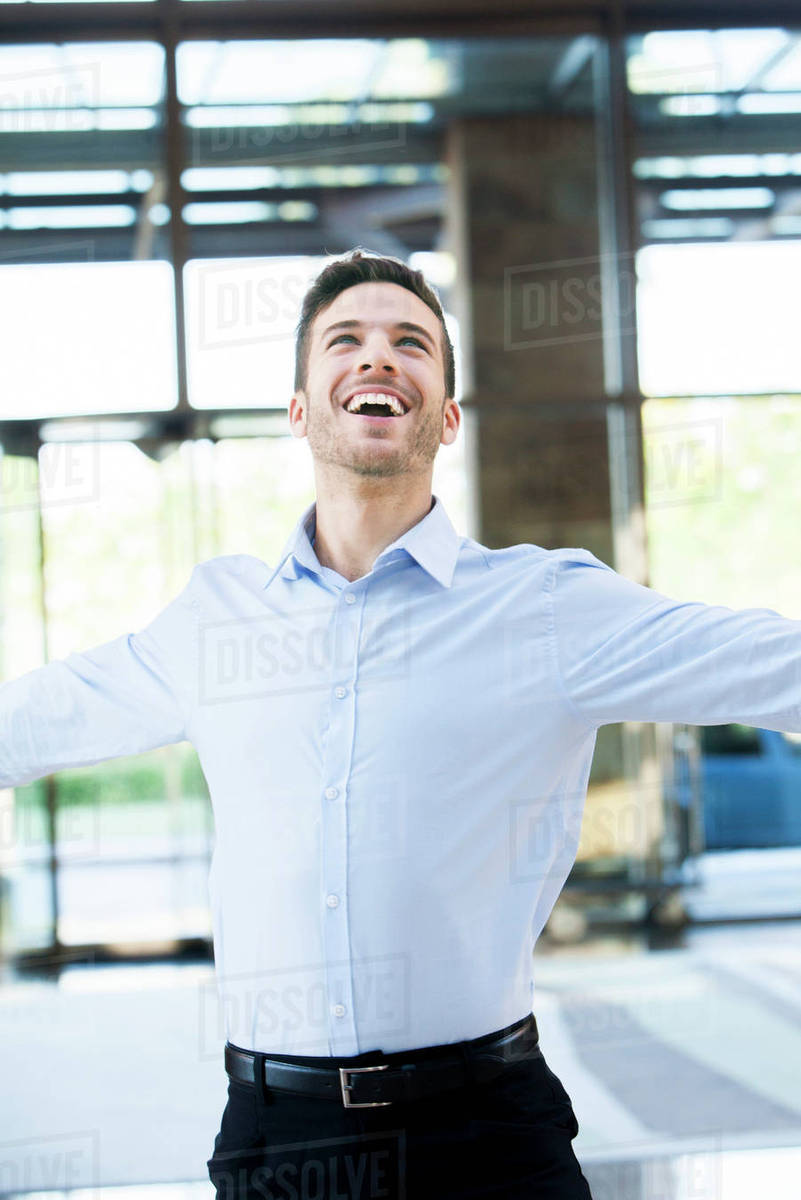 Man with outstretched arms - Stock Photo - Dissolve