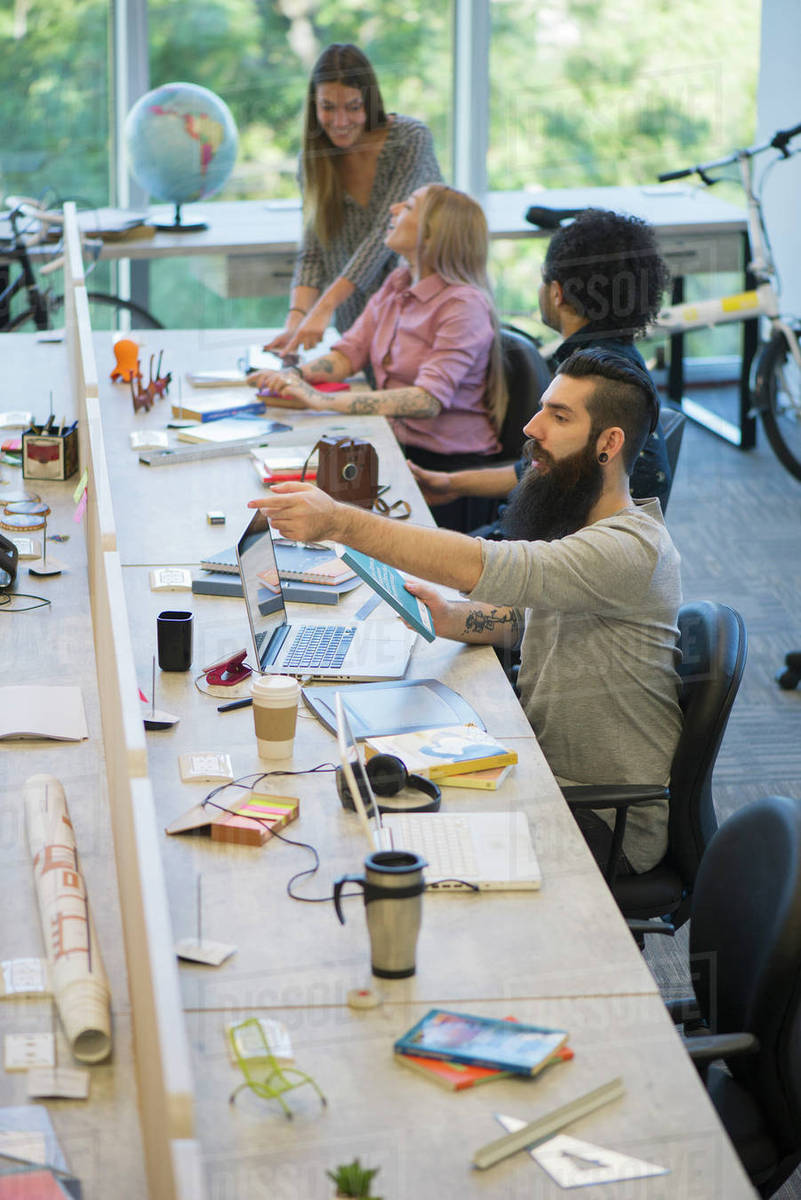 Workers at creative start-up - Stock Photo - Dissolve