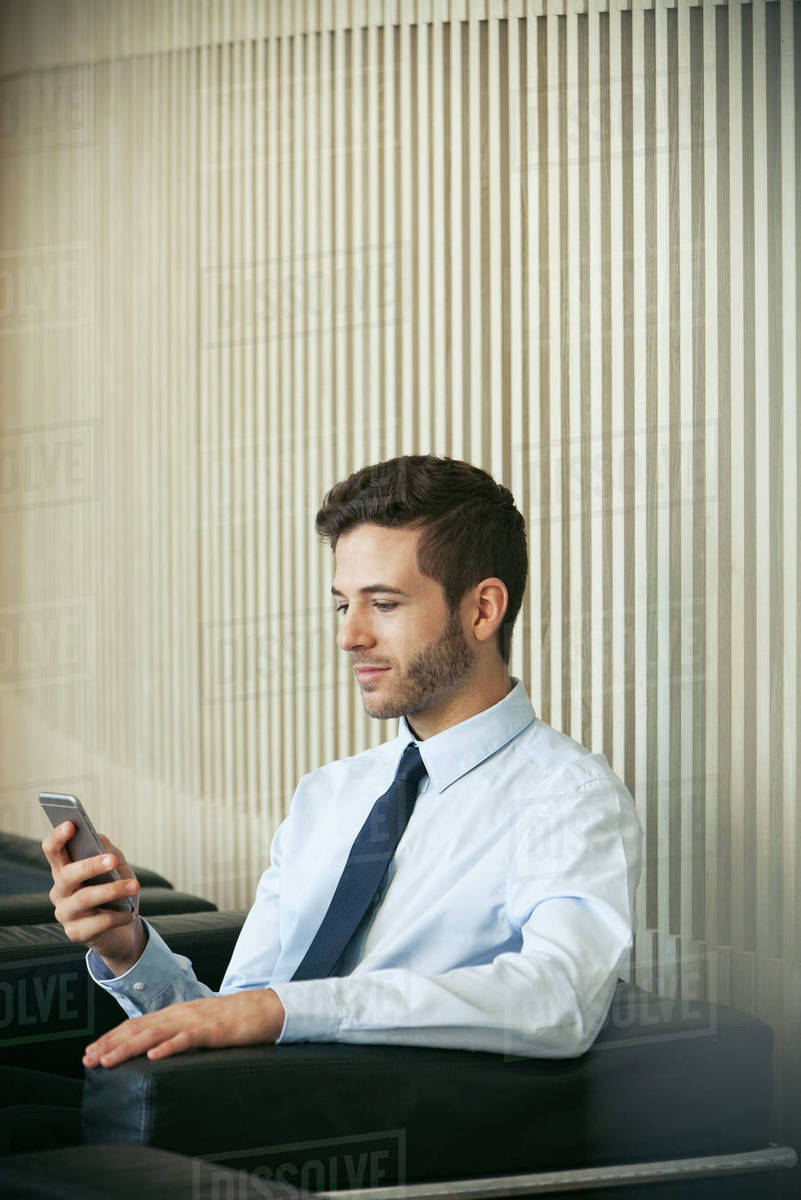 Businessman using smartphone - Royalty-free Stock Photo | Dissolve