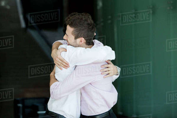 Friends hugging - Stock Photo - Dissolve