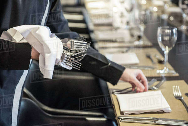 Waiter setting table - Royalty-free Stock Photo | Dissolve