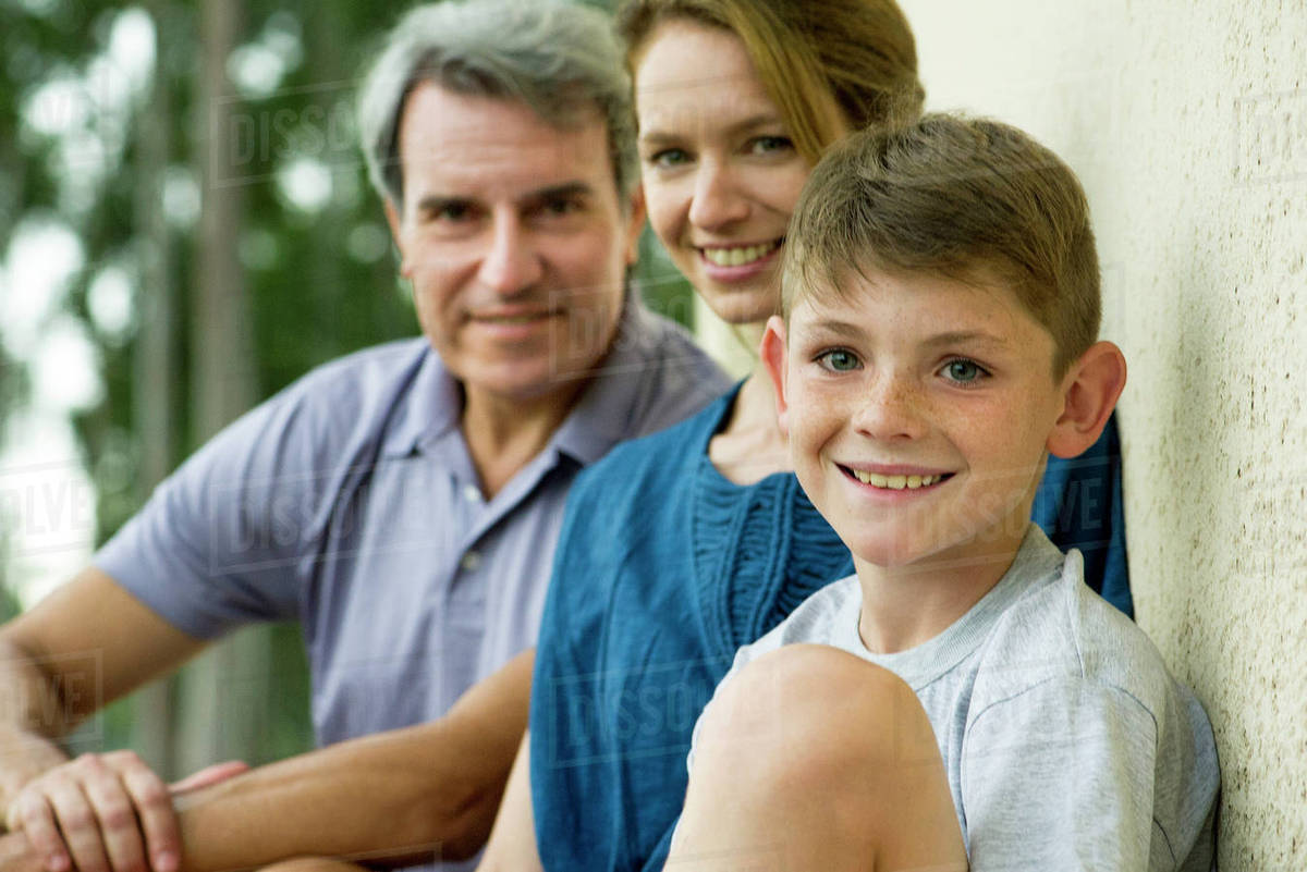 Boy with parents, portrait - Stock Photo - Dissolve