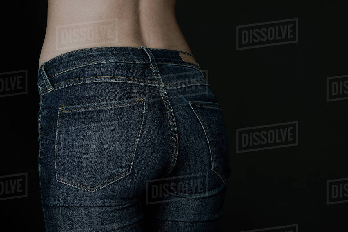 Close-up of woman's rear end in jeans - Royalty-free Stock Photo | Dissolve