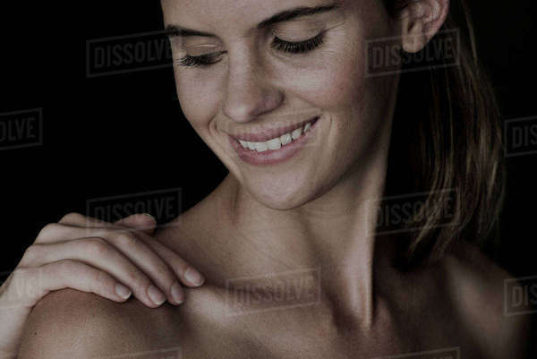 Hand touching young woman's bare shoulder - Royalty-free Stock Photo ...