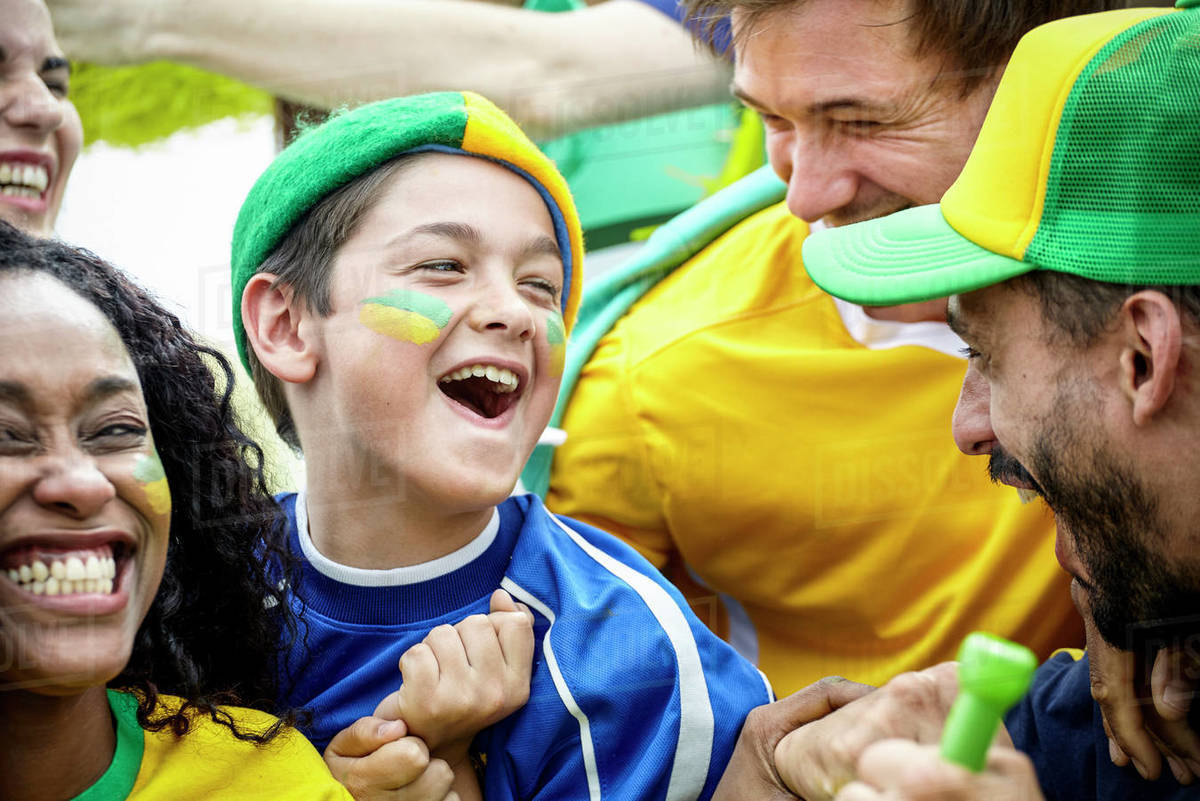 Brazilian football fans celebrating victory at match - Royalty-free ...