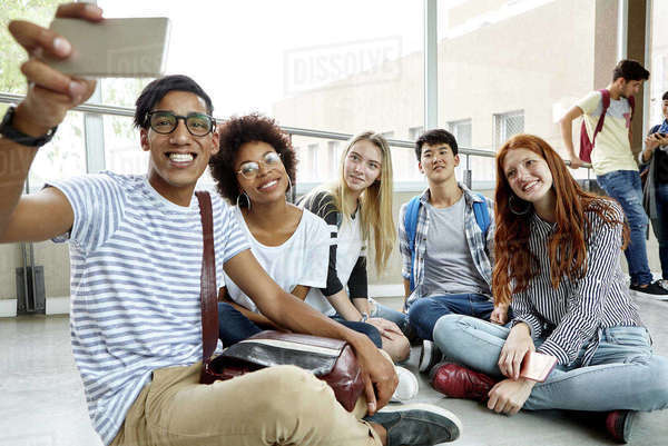 Student taking selfie with classmates - Royalty-free Stock Photo | Dissolve