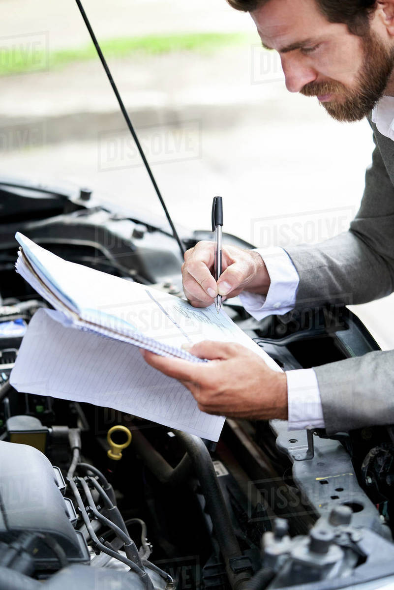 Man signing documents - Royalty-free Stock Photo | Dissolve