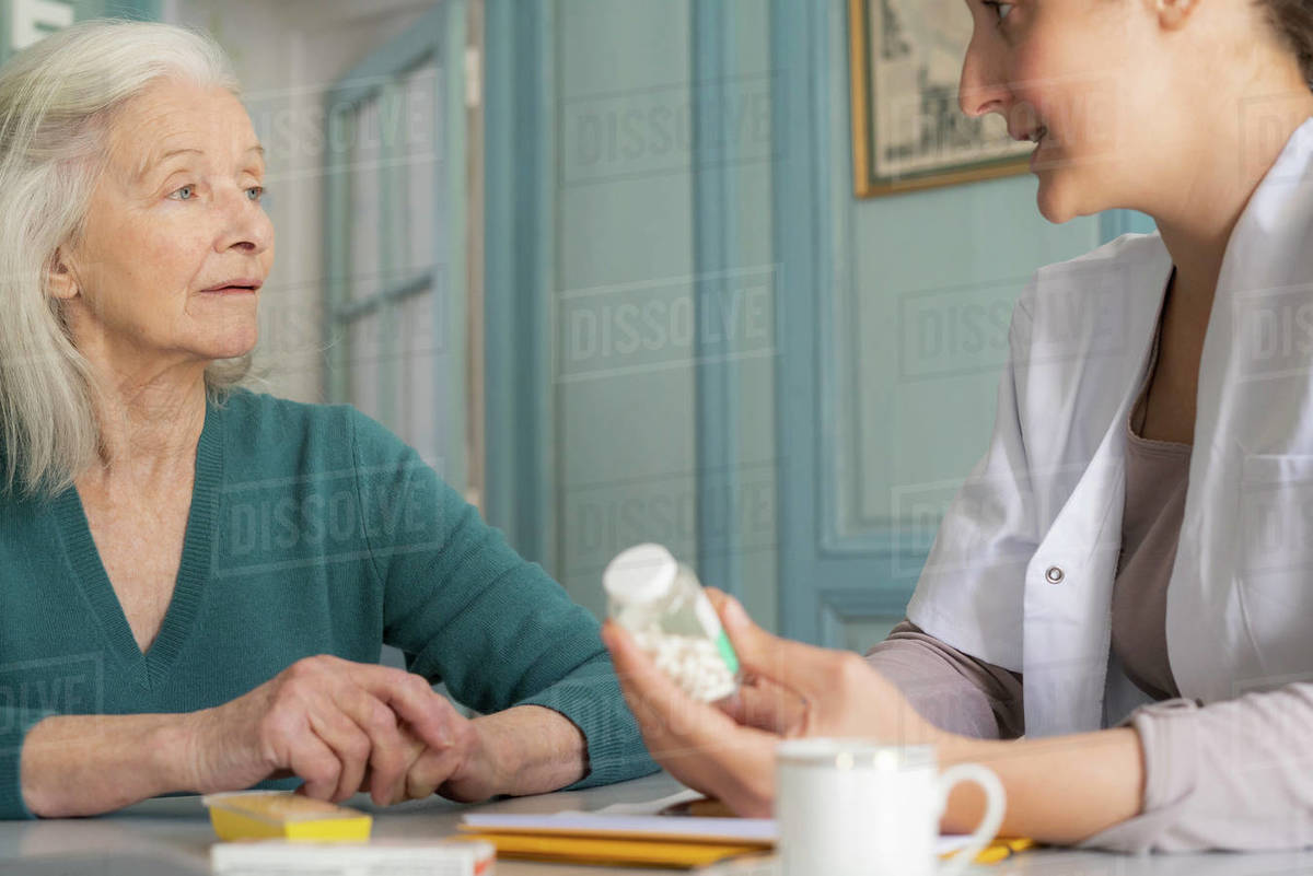 Doctor talking with patient - Stock Photo - Dissolve
