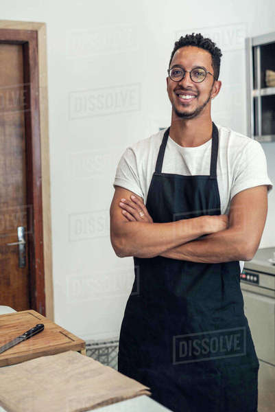 Portrait of man standing in commercial kitchen - Royalty-free Stock ...