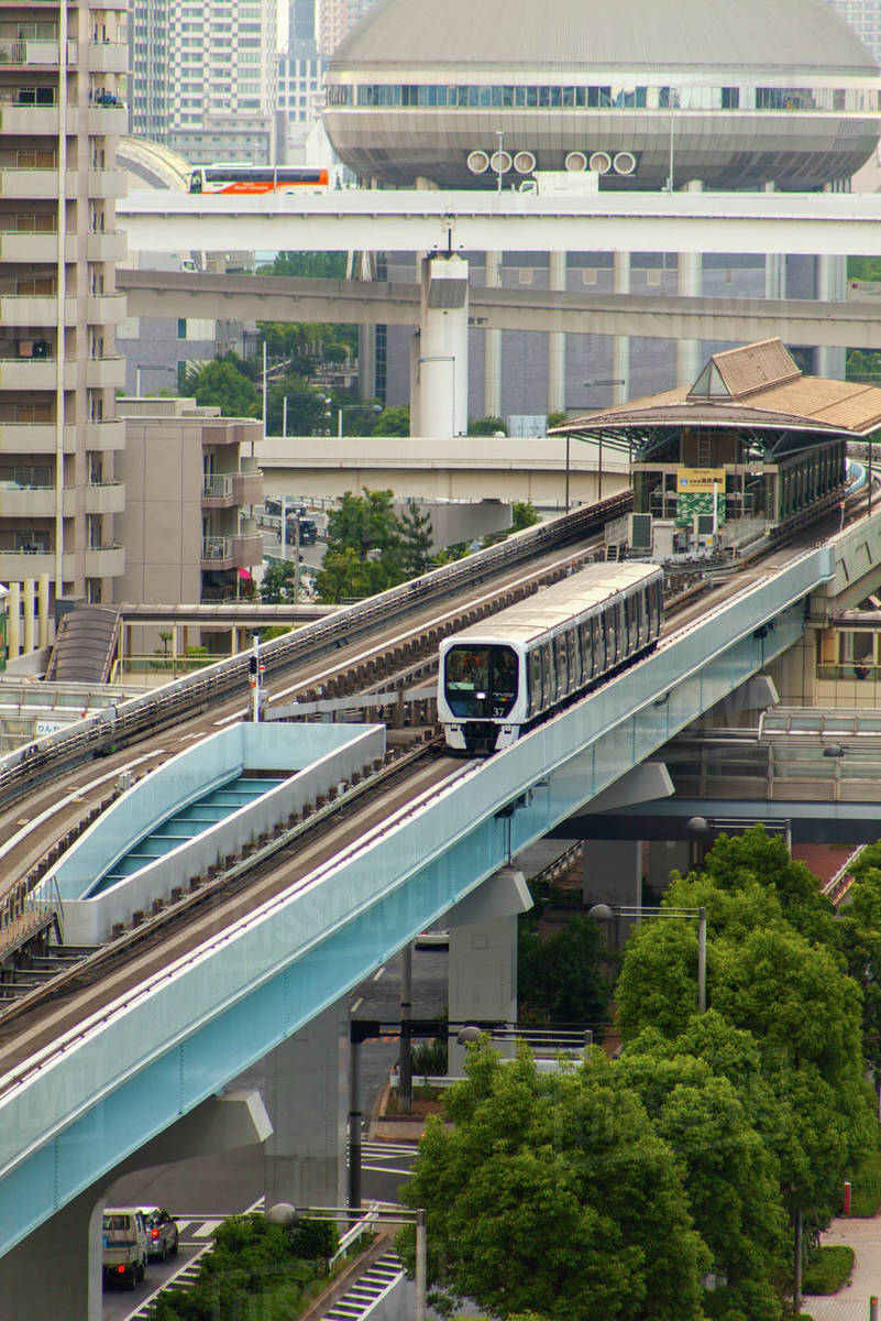 Train moving on elevated track - Royalty-free Stock Photo | Dissolve