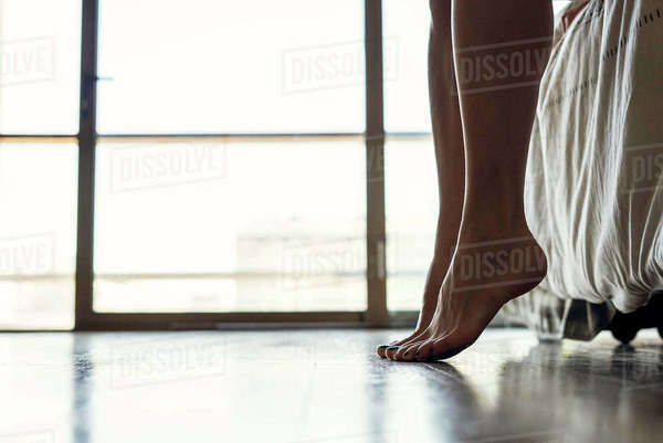 Woman stepping on floor - Royalty-free Stock Photo | Dissolve