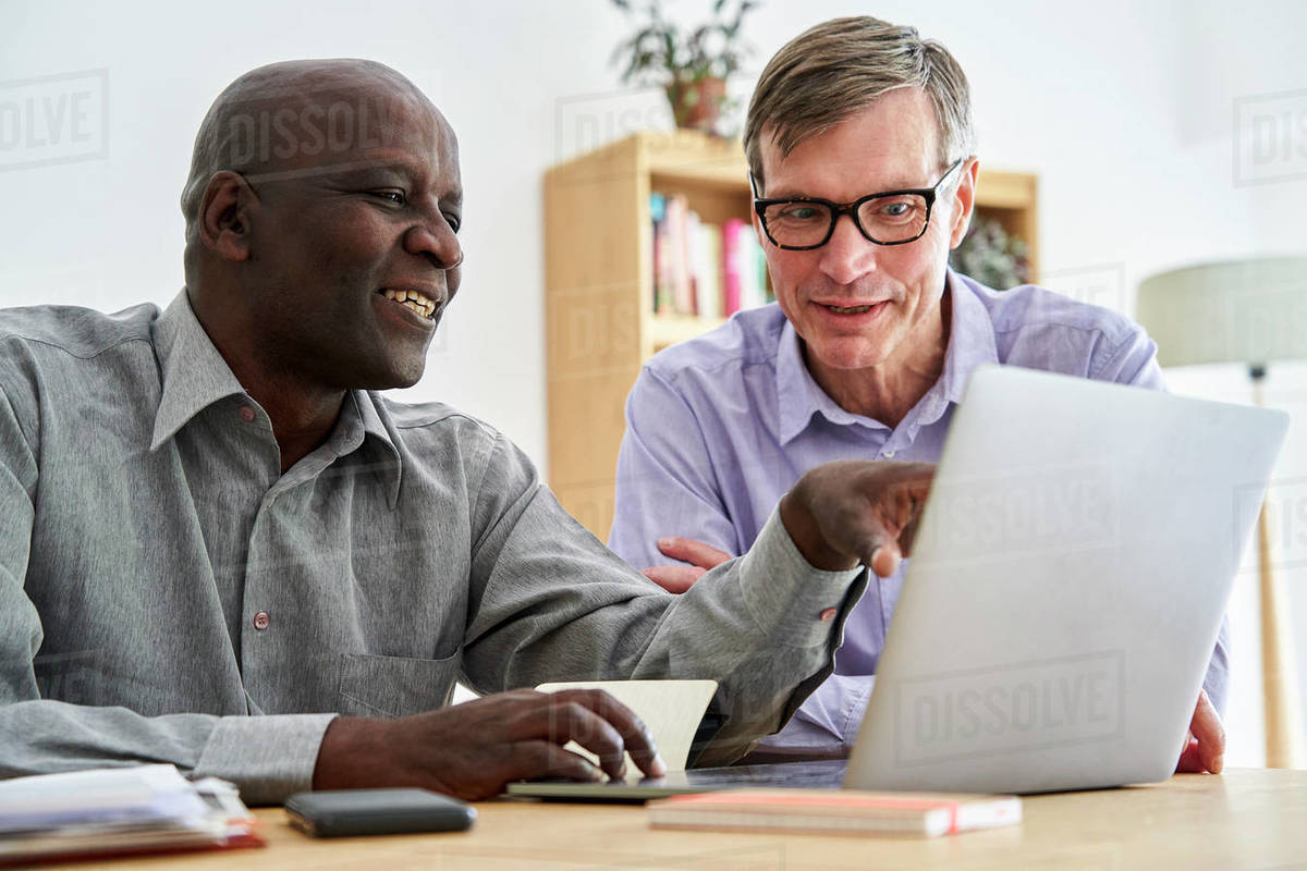 Two male business partners working together at office - Stock Photo ...