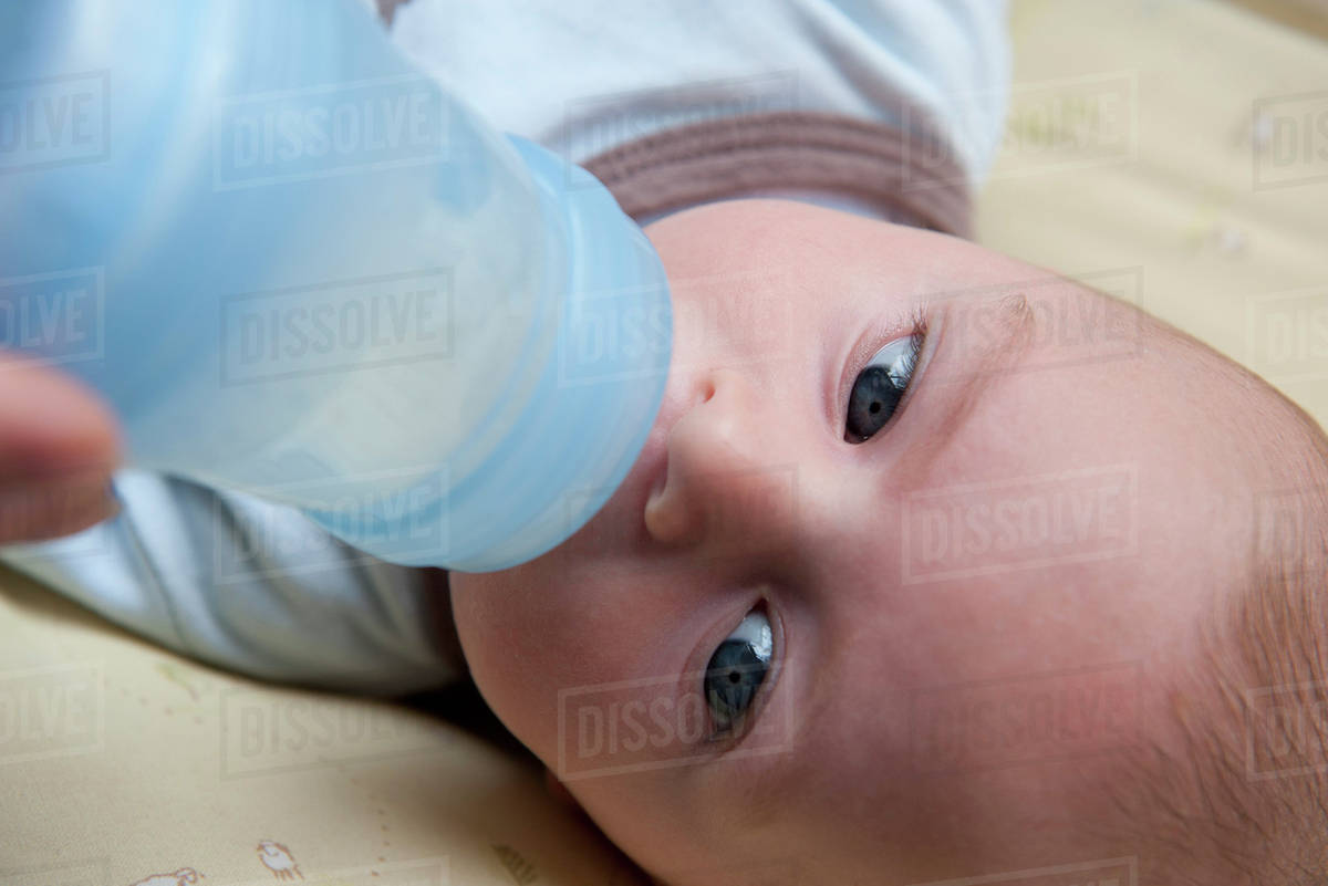 Baby drinking from baby bottle, close-up - Royalty-free Stock Photo ...