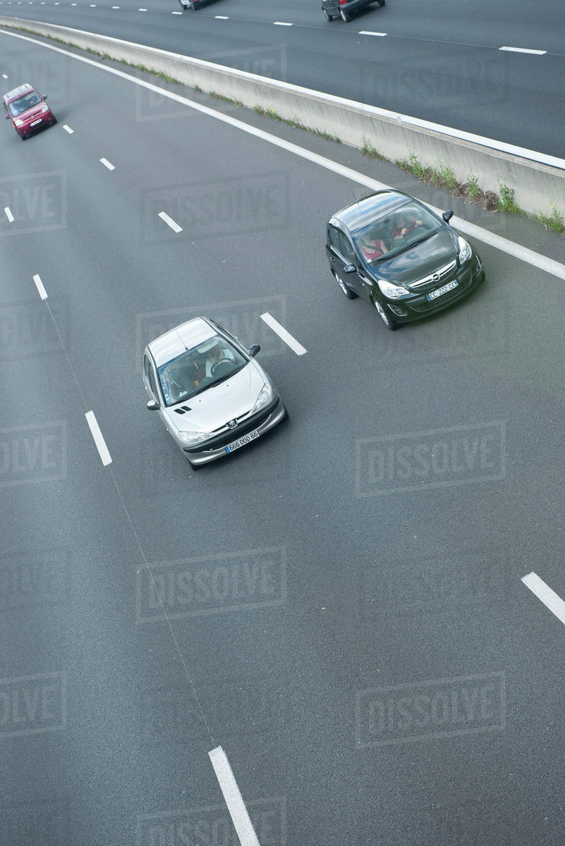 Cars drving on freeway - Stock Photo - Dissolve