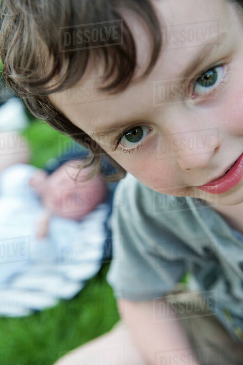 Boy looking at camera, portrait - Stock Photo - Dissolve
